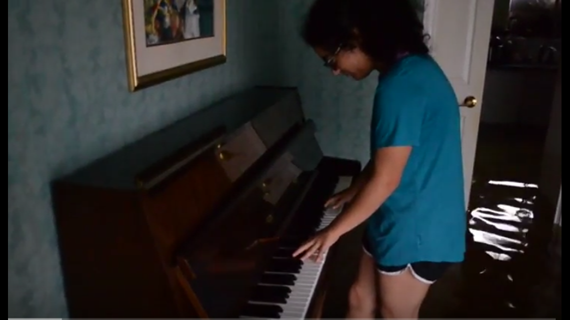 WATCH: Flooded piano gives family a final melody | wwltv.com