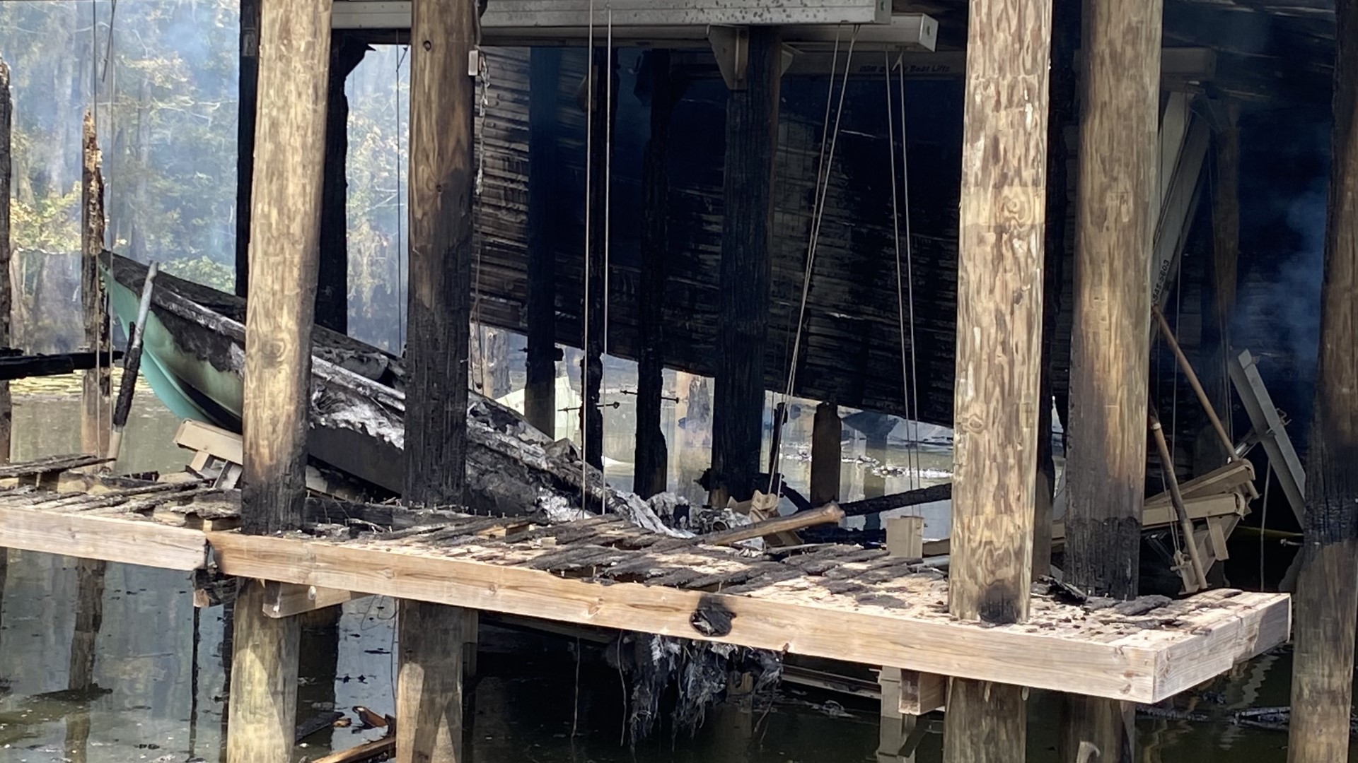 Smoldering aftermath of Covington dock fire | wwltv.com