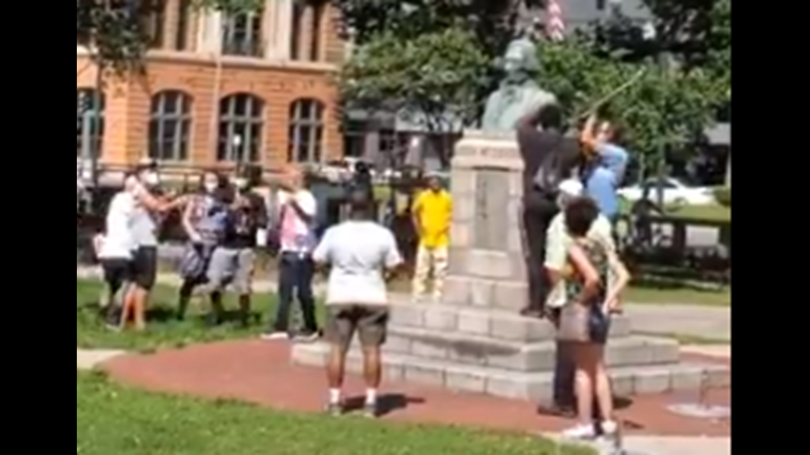 VIDEO: Duncan Plaza demonstrators drag statue through streets, throw it ...