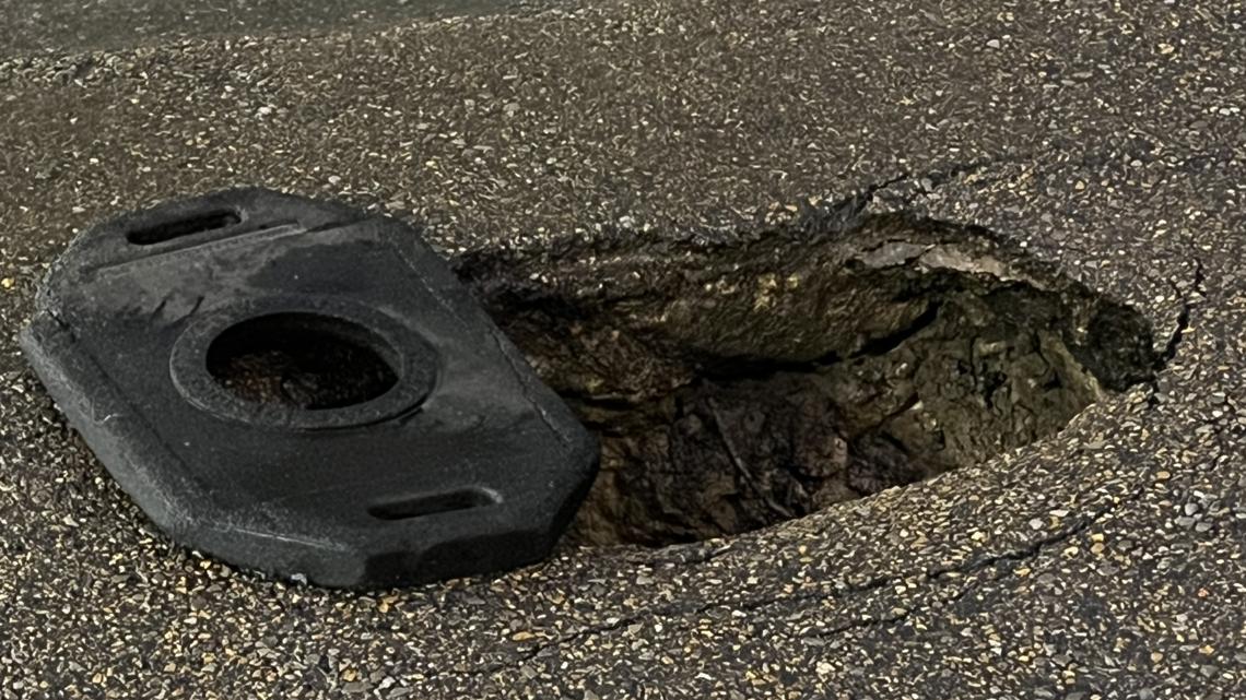 New Orleans sinkhole swallows debris, cones and cars | wwltv.com