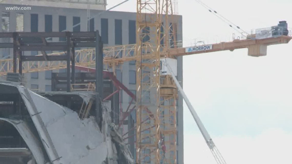 Locals, visitors wait hours to watch expected crane demolition | wwltv.com