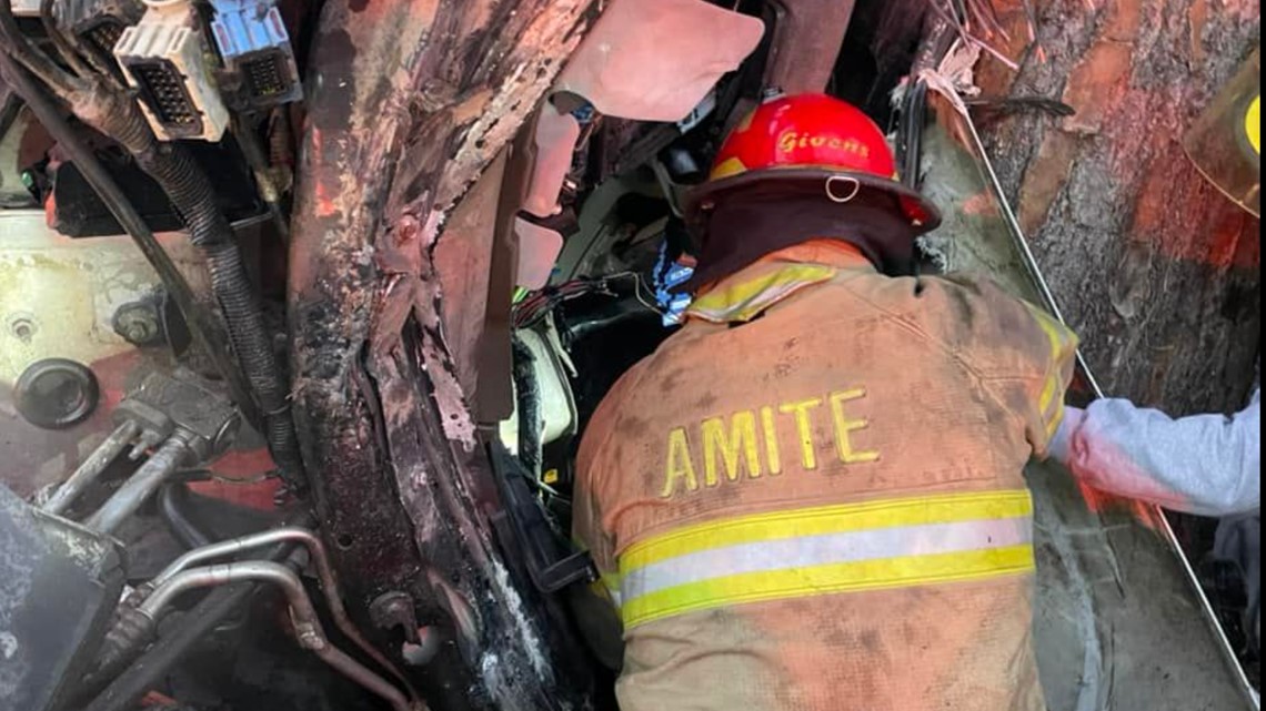 Firefighters rescue driver from 18-wheeler wreck, officials say | wwltv.com